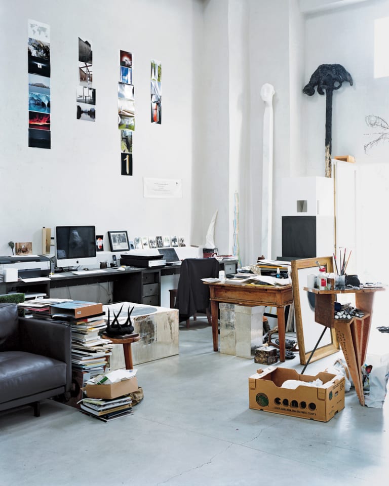 tall vertical stacks of pictures on walls 'heighten' ceilings ...